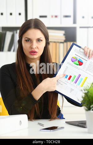 Female arm show stats graphic clipped to pad Stock Photo - Alamy