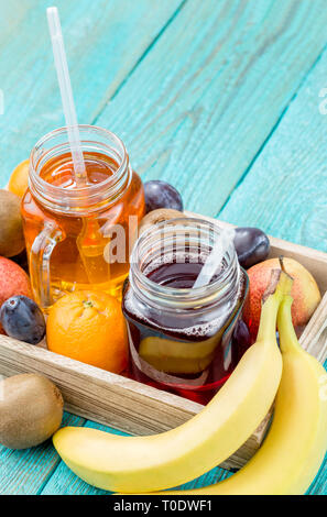 Glasses of juise with fruits on table Stock Photo - Alamy