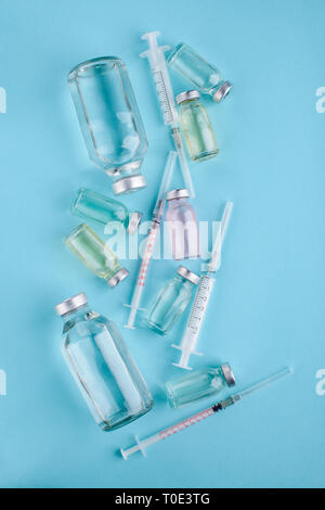 Medical syringes with remedy on color background Stock Photo - Alamy
