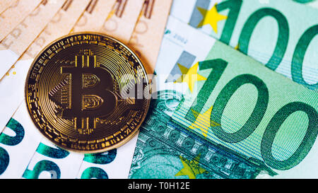 Golden bitcoin over Euro money. Bitcoin cryptocurrency. Crypto currency ...
