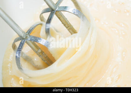 Sugar is mixed with beaten egg for dessert Stock Photo - Alamy