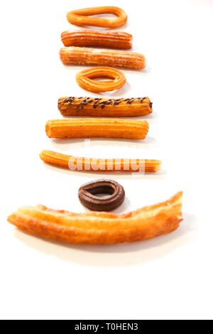 different types of spanish fritters on white background Stock Photo - Alamy