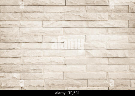 Decorative wall texture, background. Cream-colored grungy brick wall in ...