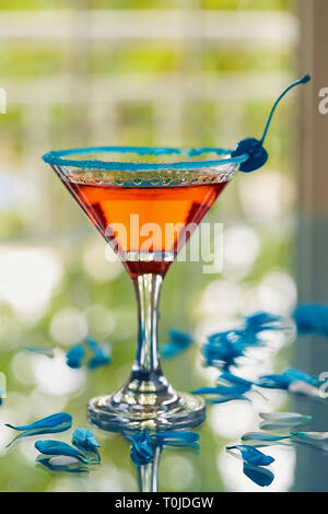 The rose exotic cocktail and fruit on blue Stock Photo - Alamy