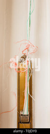 a rope of a roller shutter frayed due to consumption Stock Photo - Alamy