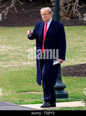 President Donald Trump gestures as he walks on stage for the first ...