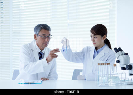 Japanese researchers in the lab Stock Photo - Alamy