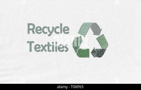 Recycle textiles symbol made from old clothing fabric on green ...