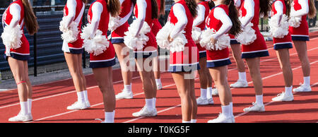 Cheerleaders performing routine Stock Photo - Alamy