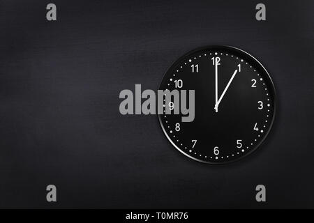 Wall clock show one o'clock on white marble texture. Office clock show ...