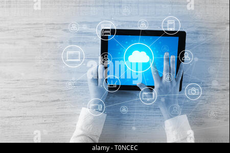 Hand touching multitask tablet with cloud wifi message social media ...