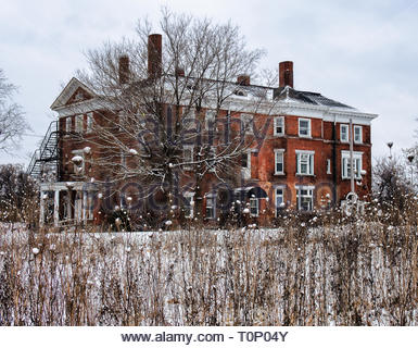 brick manor home in the wintertime Stock Photo - Alamy