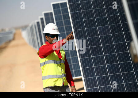 Aswan. 18th Mar, 2019. A man works in a TBEA solar power station in ...