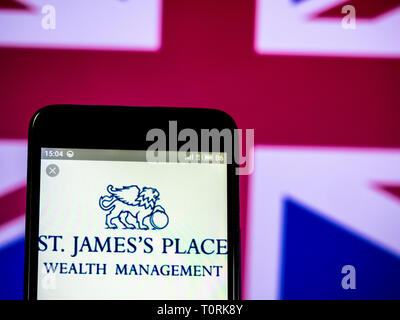 St. James's Place plc logo seen displayed on smart phone Stock Photo ...
