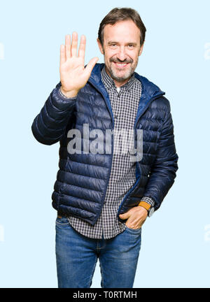 Hello winter. smiling elegant middle aged woman in beige sweater ...
