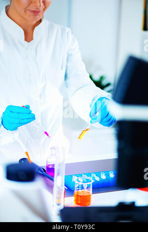 Quality control expert inspecting whiskey in the laboratory Stock Photo ...