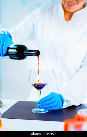 bottle of wine in the quality control laboratory Stock Photo - Alamy