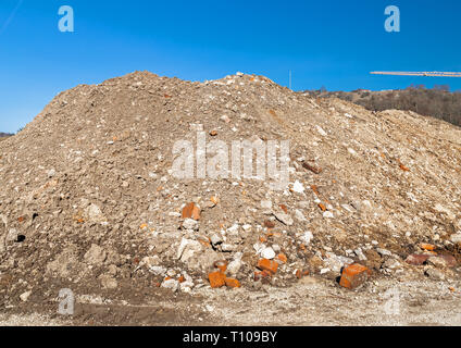 Construction site debris pile of waste, used bricks, concrete slabs ...