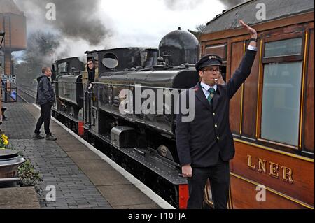 Driver of steam locomotive GWR pannier tank 7752 waits to leave at ...
