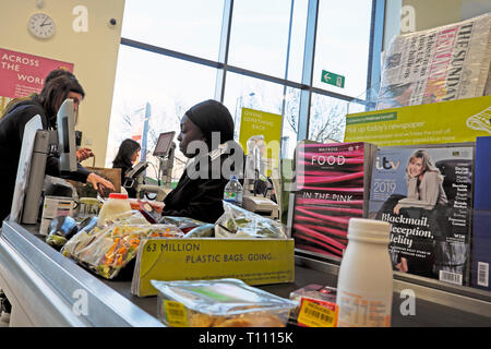 Waitrose supermarket employee young black woman working on till at ...