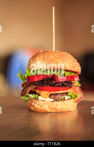 Gourmet beef burger topped with egg and onion Stock Photo - Alamy