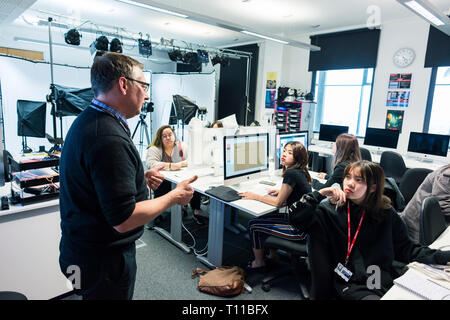 a media studies classroom full of students learning during a lesson ...