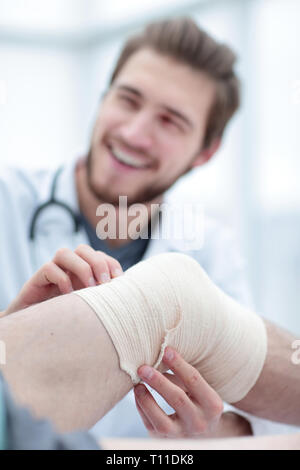 closeup of a doctor examining injured leg of the patient Stock Photo ...