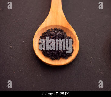 Hawaii black salt on wooden spoon Stock Photo - Alamy
