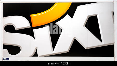 Sixt company logo at the car rental desk of Sixt AG at Munich Airport ...