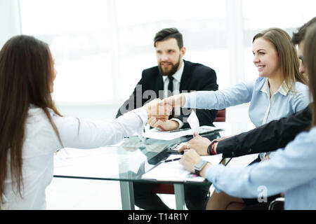 colleagues confirming the job with a handshake Stock Photo - Alamy