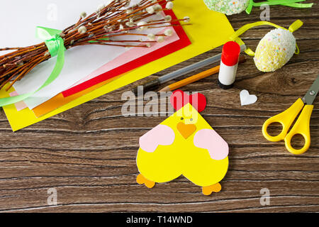 Easter postcard Easter chicken on a wooden table. Handmade. Project of ...