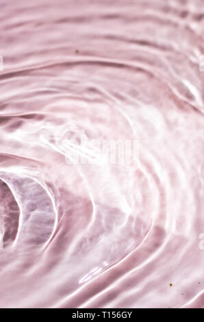 Pink flowing water texture as an abstract background - colourful ...