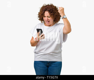 Middle ager senior woman using and texting with smartphone over ...