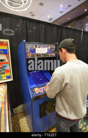 People playing a vintage Pac-Man video arcade game - USA Stock Photo ...