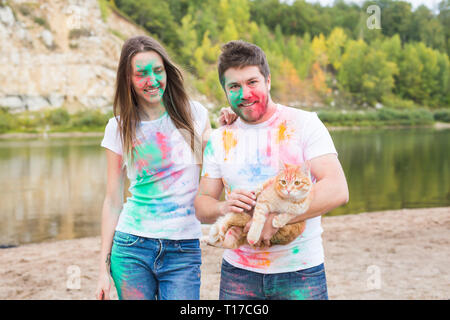 Festival holi , tourism and nature concept - Portrait of woman and man ...