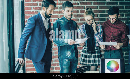 business team with documents being prepared to discuss the advertising ...