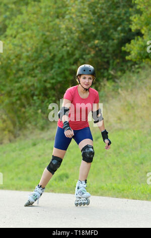 Young people rollerblading Stock Photo - Alamy