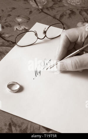 sepia image of feather and pen Stock Photo - Alamy