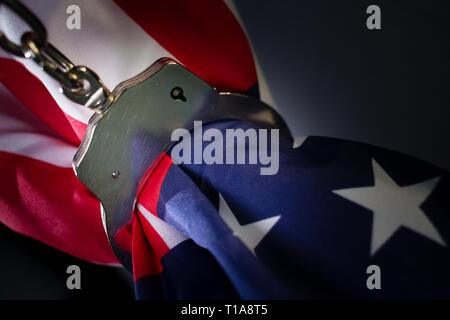 Handcuffs on an American Flag Stock Photo - Alamy