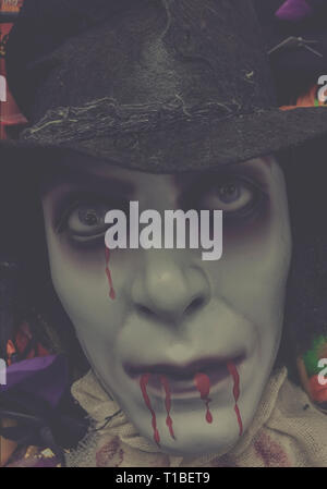 Scary monster zombie mask with bloody face and evil expression on ...