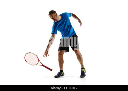 Stressed tennis player throwing and breaking a racket in anger and rage ...
