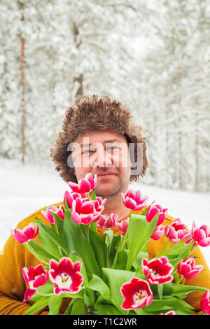 Flower for March 8. Bearded man with tulip flower bouquet. Love date ...