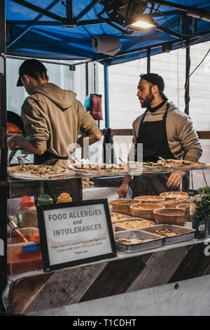 Set of different people with delicious pizza on color background Stock ...