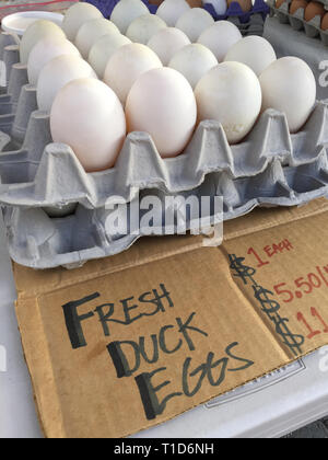 Fresh eggs in carton at a market in the morning Stock Photo - Alamy