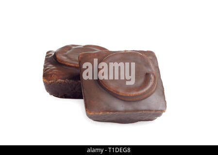 Small chocolate and vanilla layered cakes in rows on candy buffet ...
