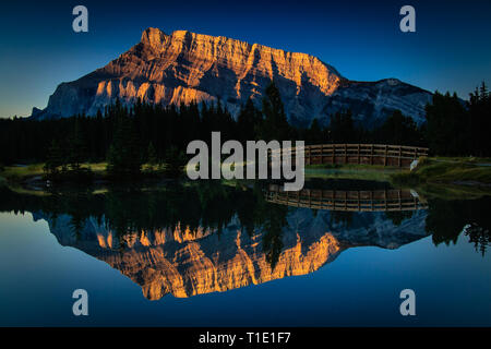 Perfect still reflection of Mount Rundle in Two Jack Lake in Banff ...
