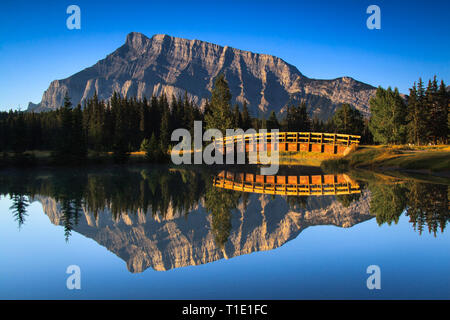 Perfect still reflection of Mount Rundle in Two Jack Lake in Banff ...