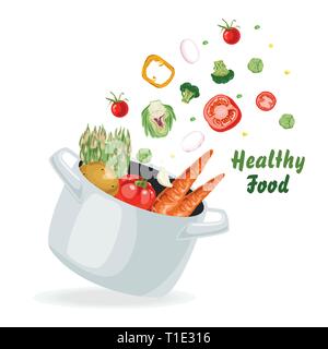 Vegetables fall into the pot or kitchen pan. Concept diet and healthy ...