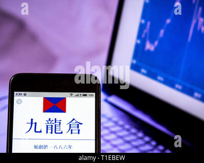 In this photo illustration a Wheelock & Co logo seen displayed on a ...