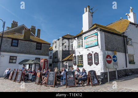 The famous Sloop Inn St.ives in Black and White with red telephone box ...